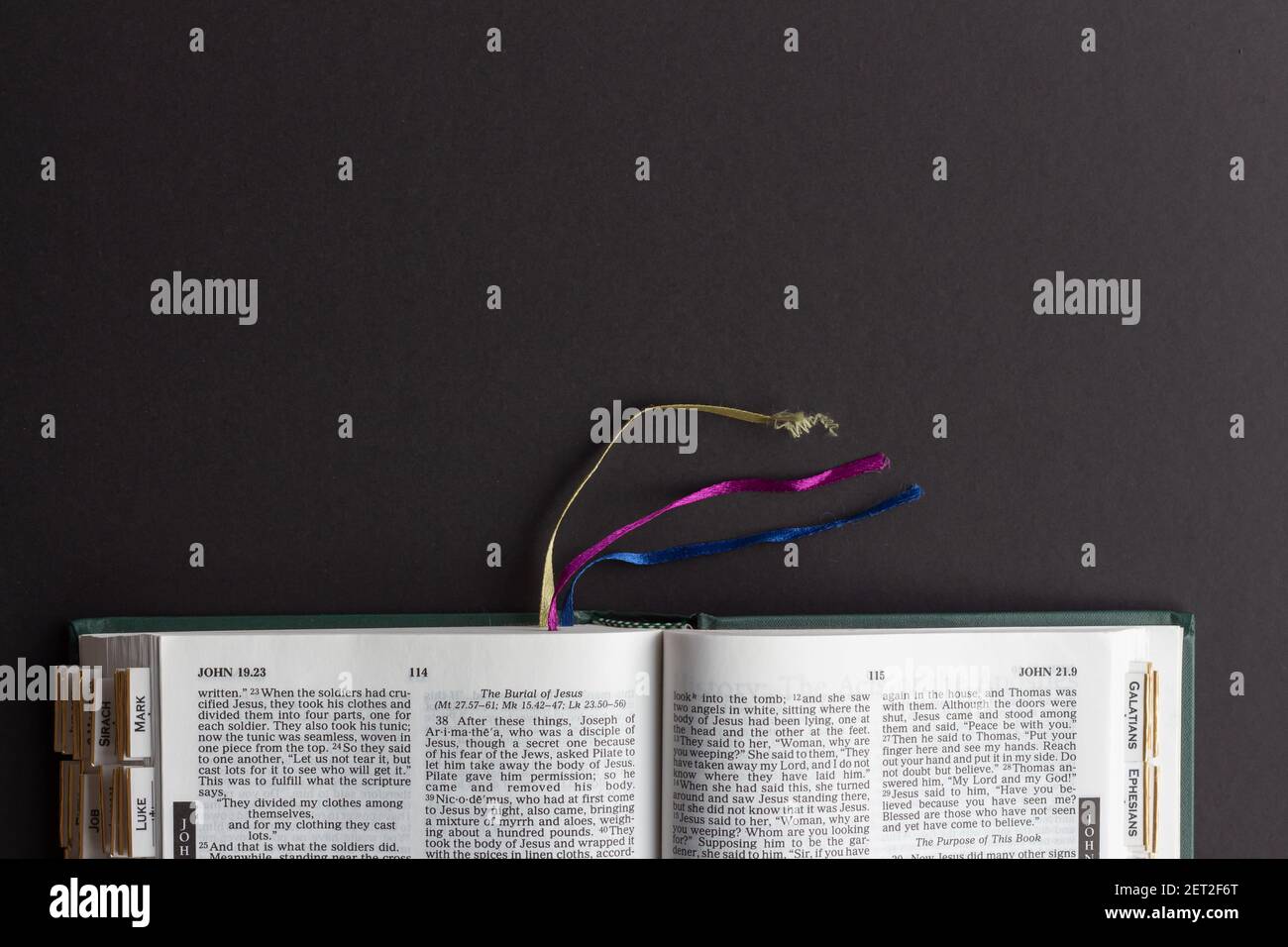 Open bible border on a black background with copy space Stock Photo - Alamy