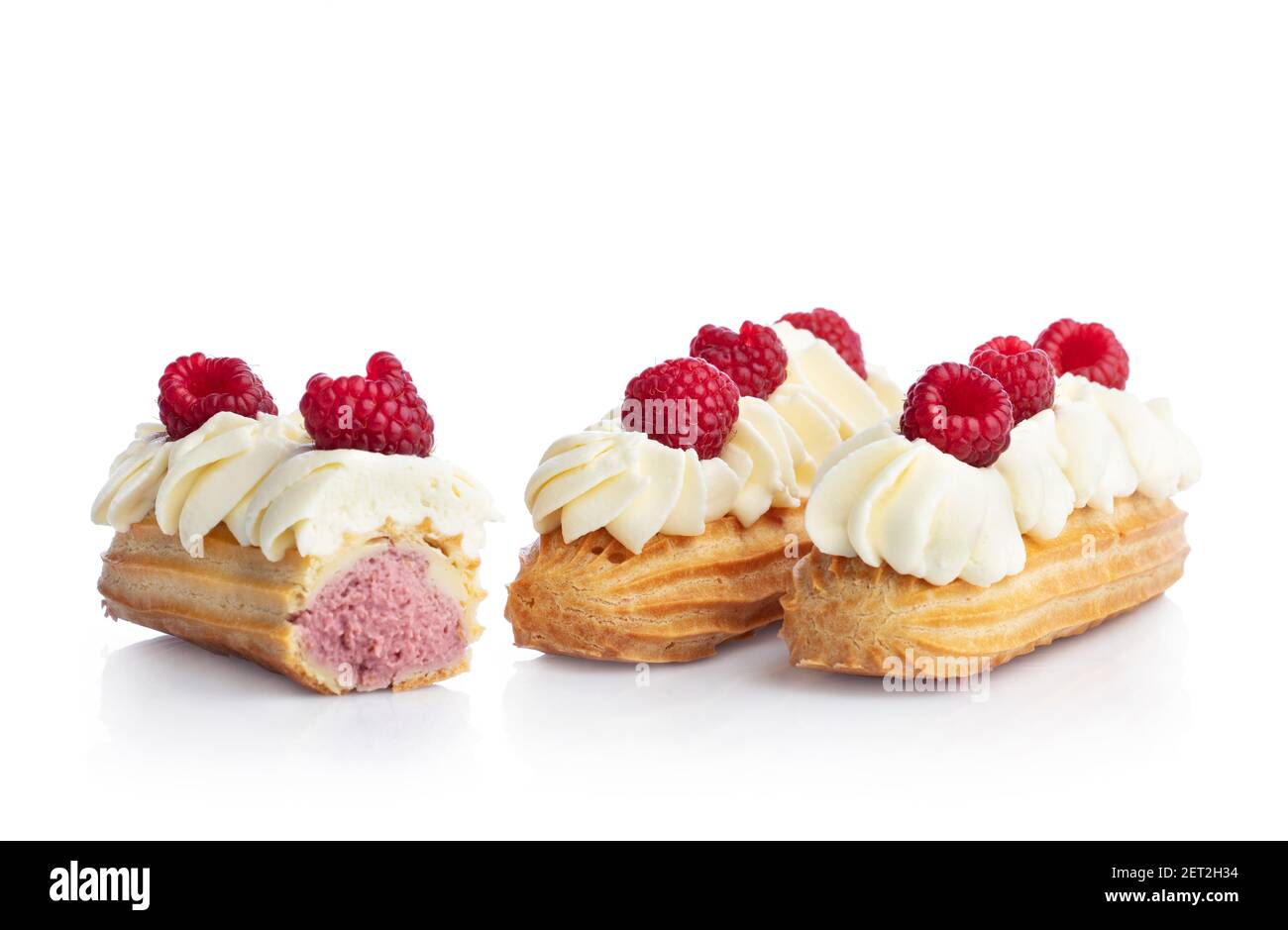 Raspberry eclairs isolated on white background. Tasty french snack ...
