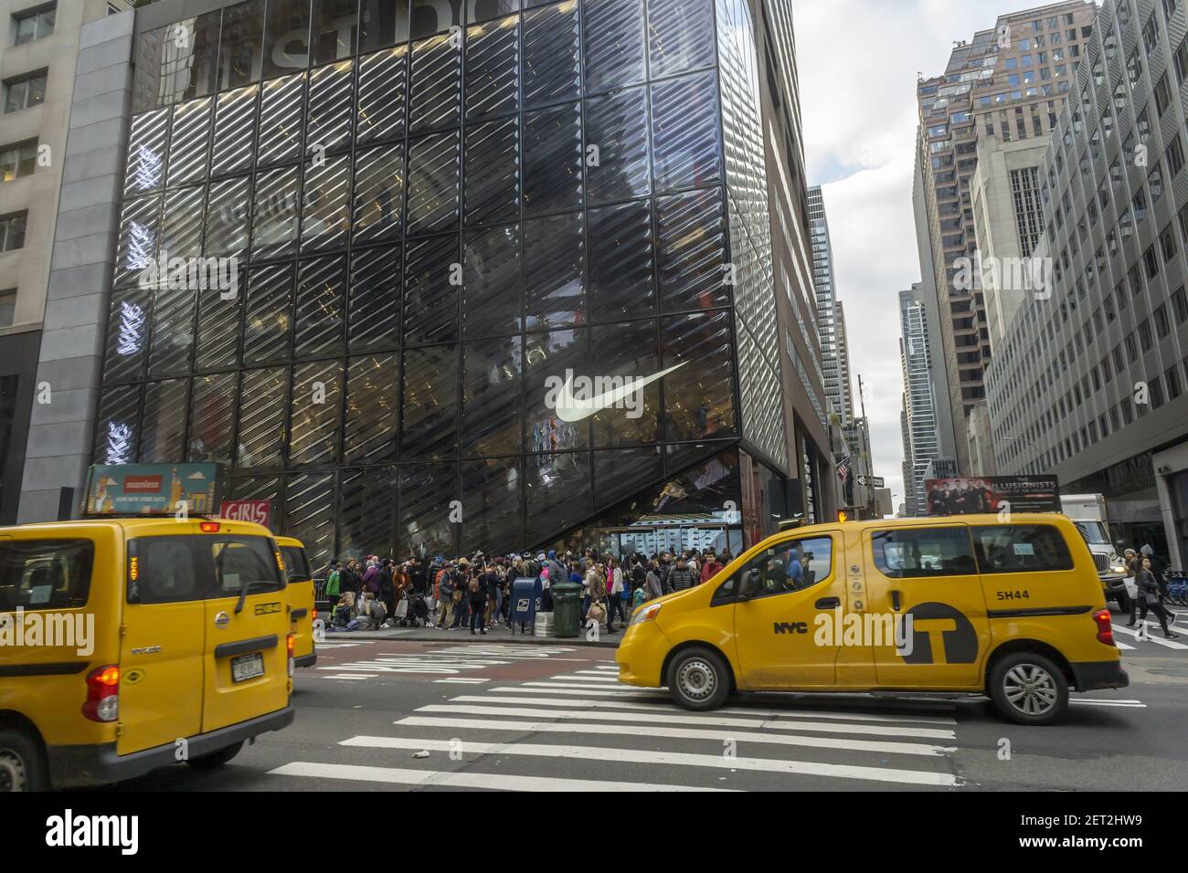 Shoppers and visitors outside the newly opened Nike flagship store on ...