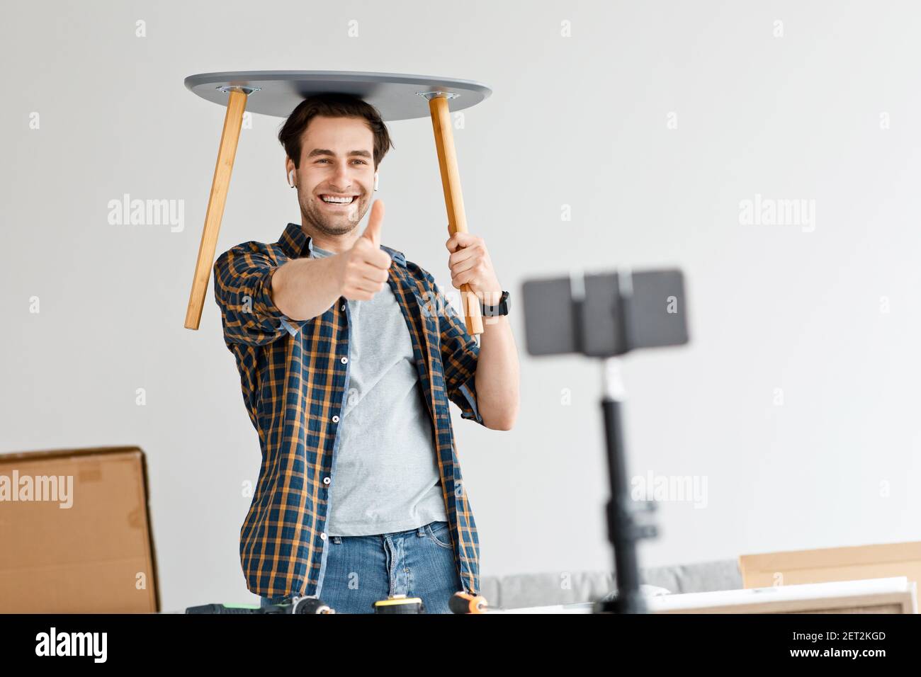 Modern blogger, funny video about renovation and furniture Stock Photo ...