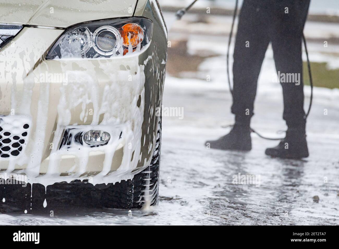 Cleaning the car, car care concept. car wash with water and foam ...