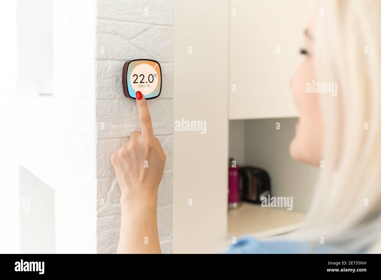 Thermostat smart home domotic control panel on wall for winter house ...