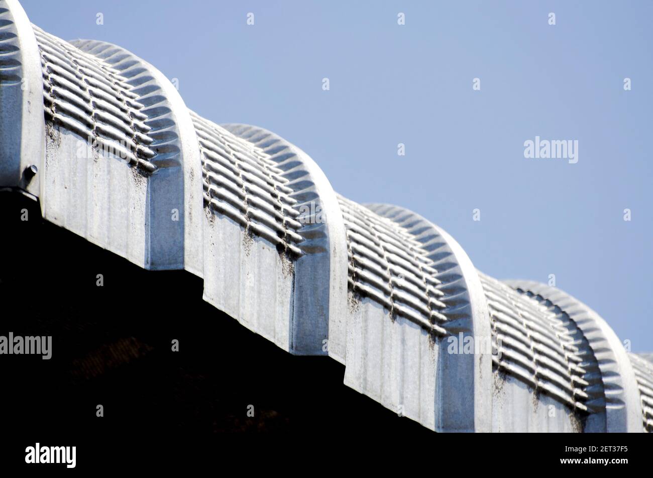 A low angle shot of curved metal sheet roof Stock Photo - Alamy