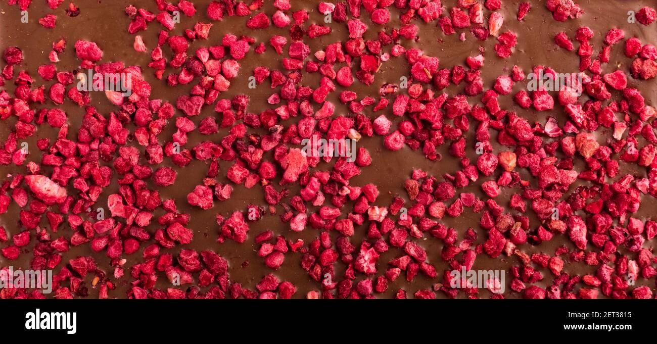 Chocolate bar with dried raspberries Stock Photo - Alamy