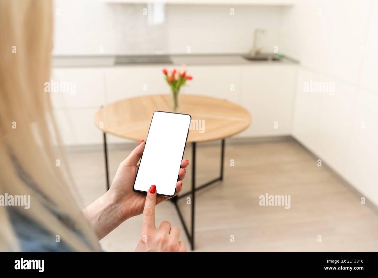 Woman using smartohone in smart house, empty screen Stock Photo - Alamy
