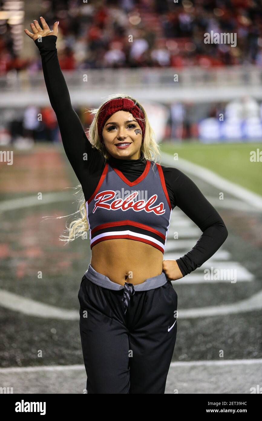 November 24, 2018: A UNLV Rebels cheerleader waves to the crowd during ...