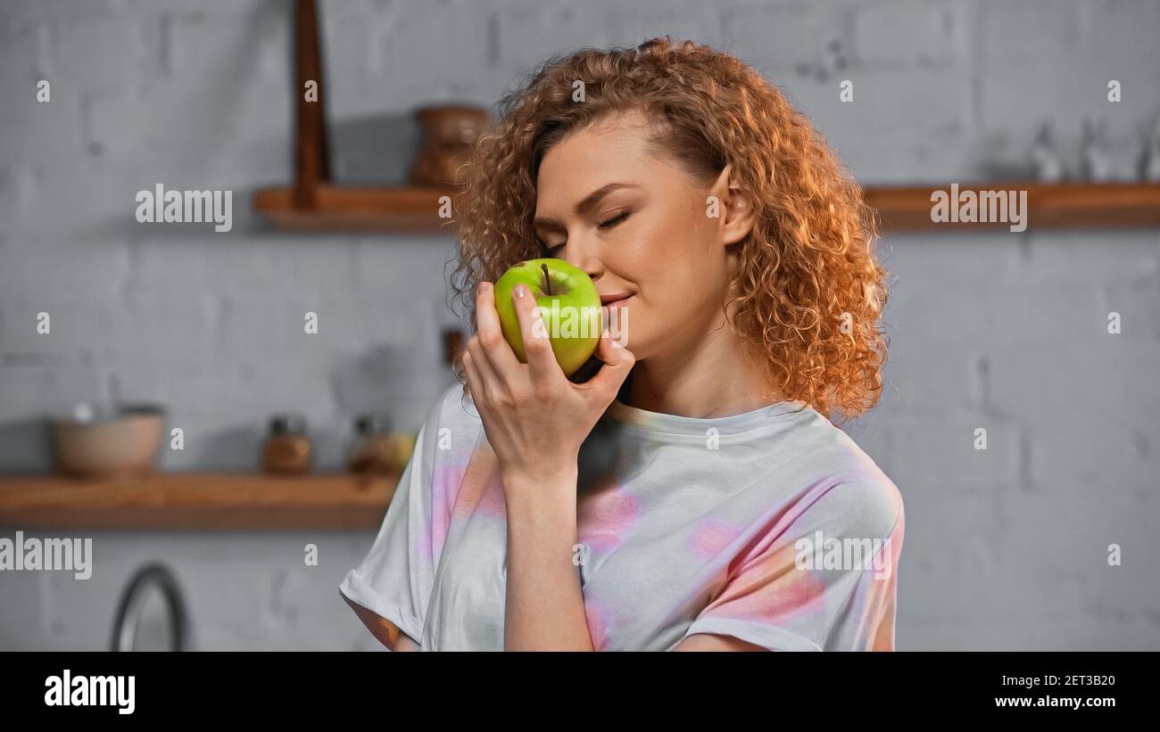 Woman smelling green apple hi-res stock photography and images - Alamy