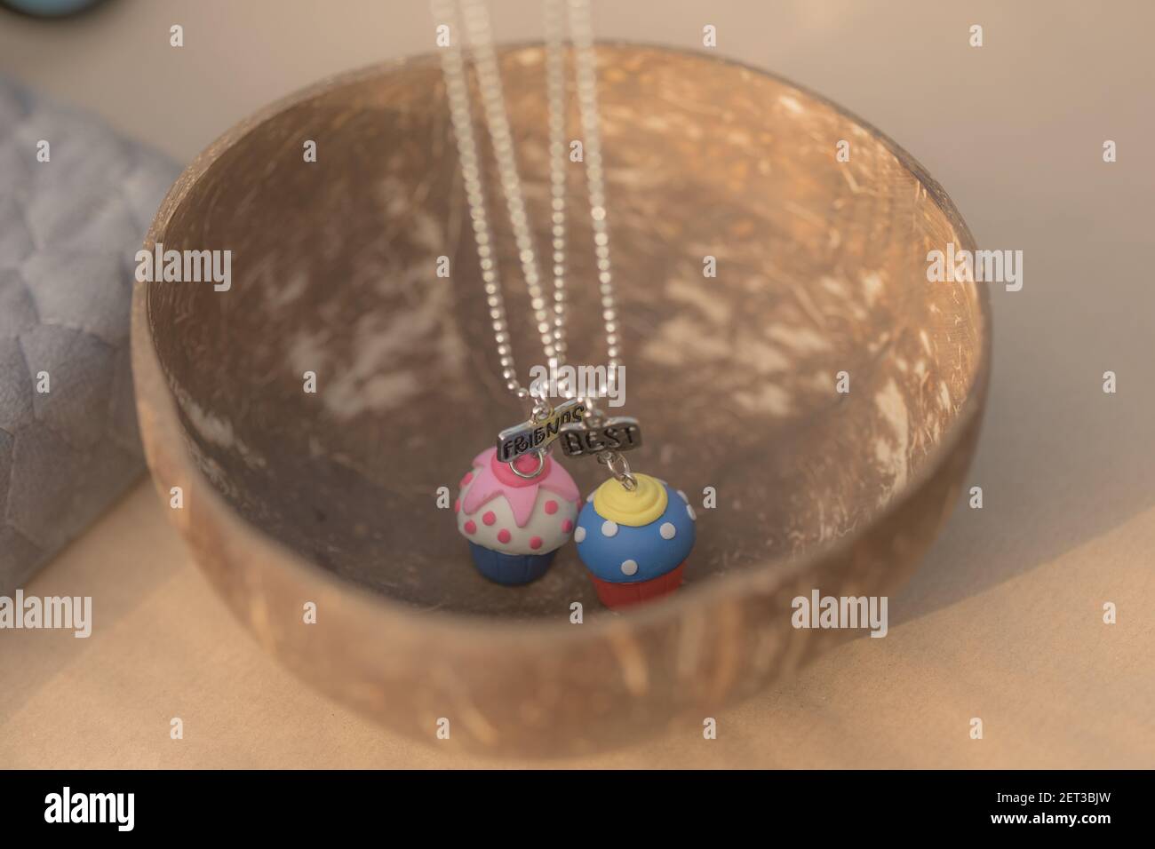 Best friends necklace shoot outside in a summer day closeup. Selective ...