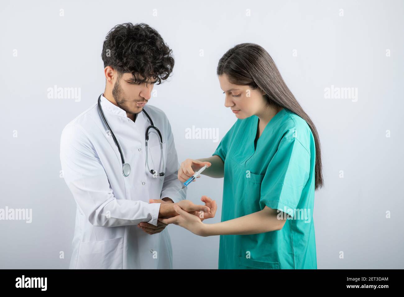 Female doctor injection hi-res stock photography and images - Alamy
