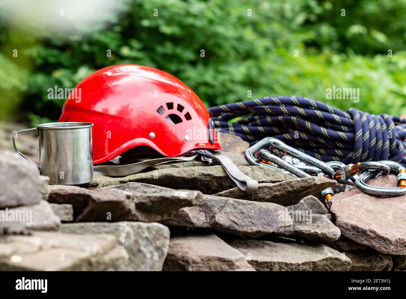 Rope access tools: hard hat, rope, carabiner. Mountaineering equipment ...