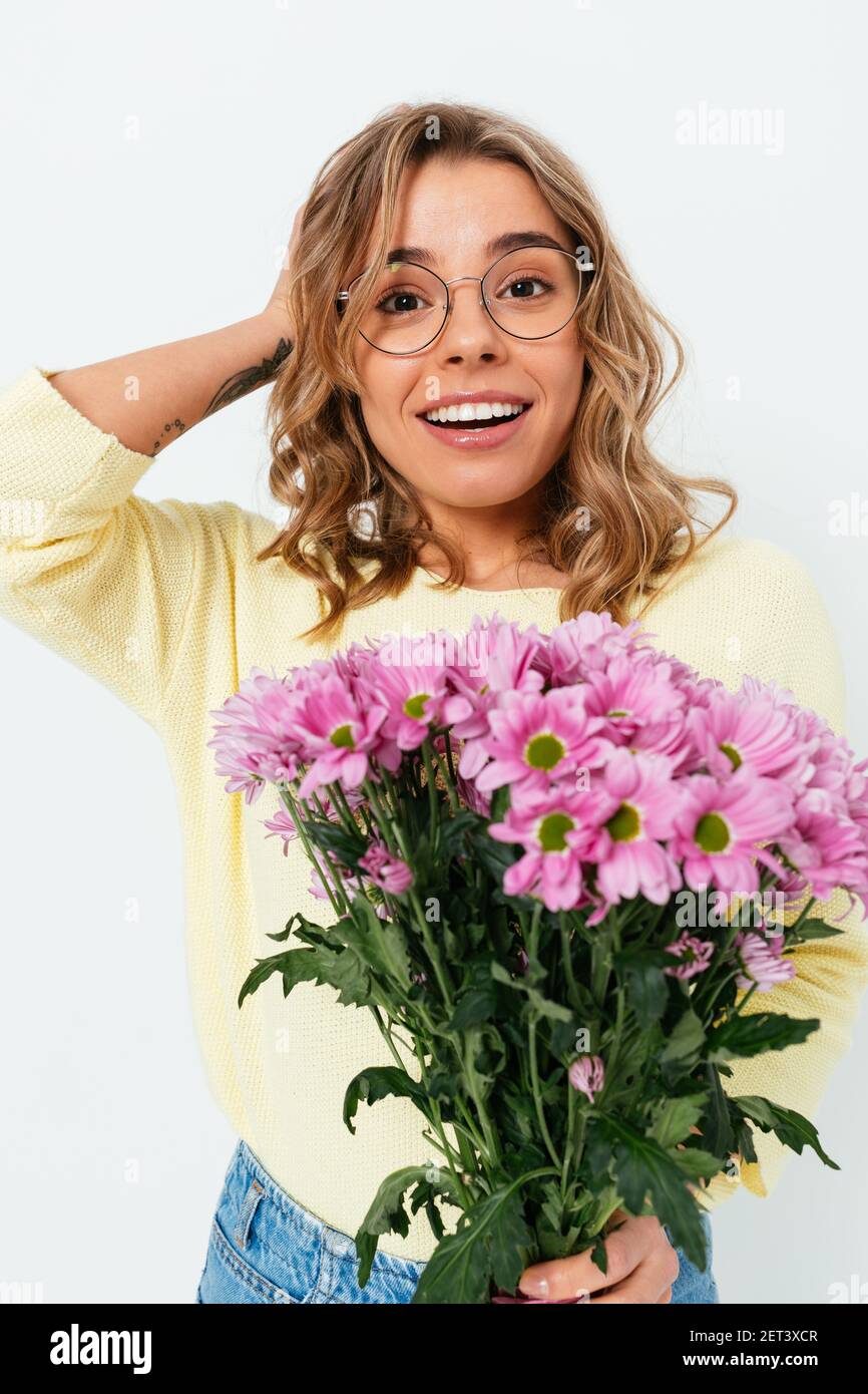 Portrait excited happy young woman wearing casual outfit and glasses ...