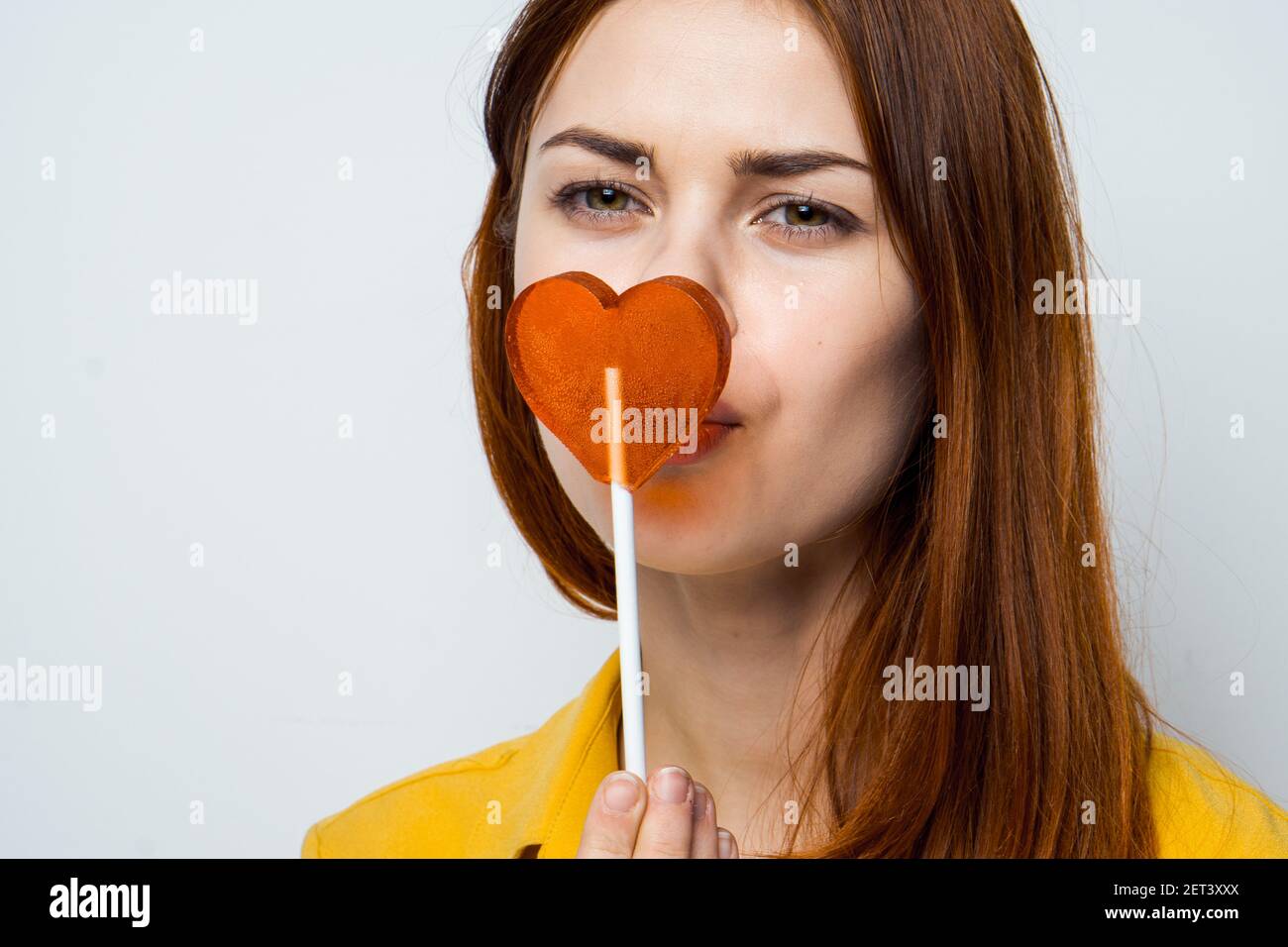 Cheerful attractive woman licking hi-res stock photography and images ...