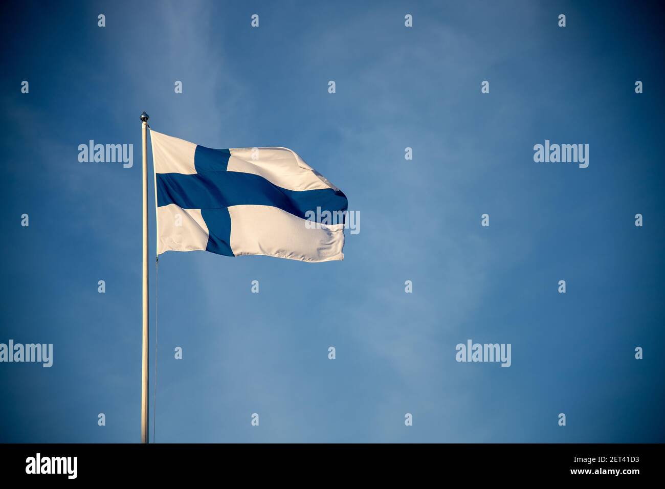 The Finland flag waving in the wind Stock Photo - Alamy