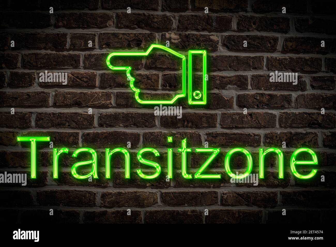 Detail photo of a neon sign on a wall with the German title Transitzone ...
