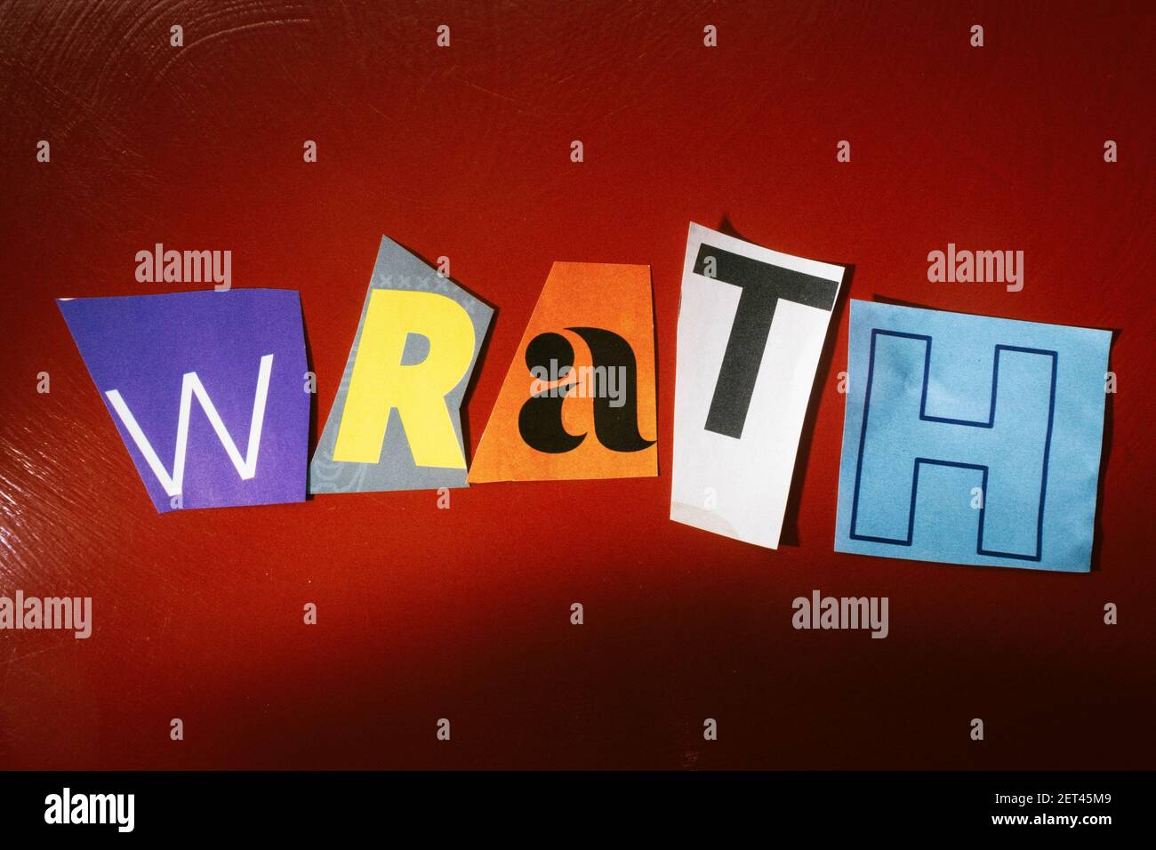 The word "Wrath" using cut-out paper letters in the ransom note effect ...