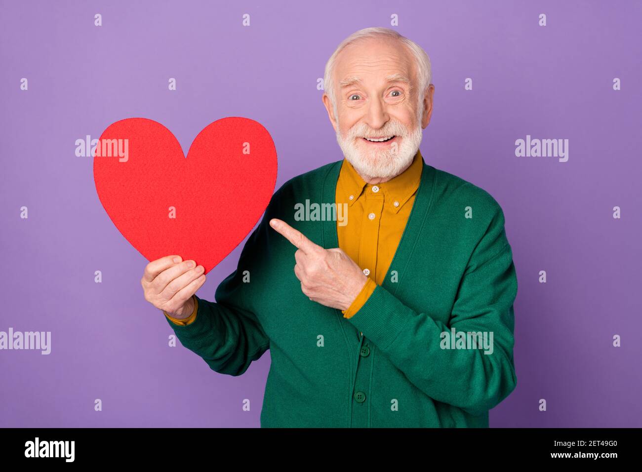 Portrait of handsome person indicate finger large red paper heart ...