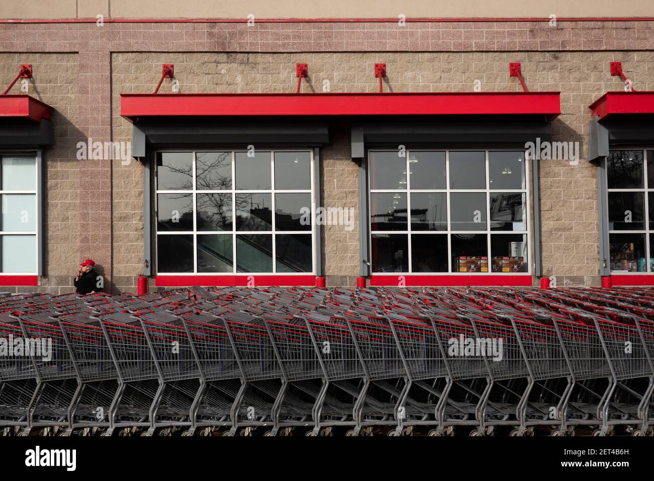 Costco worker taking break in front of store in Brooklyn NYC Stock ...