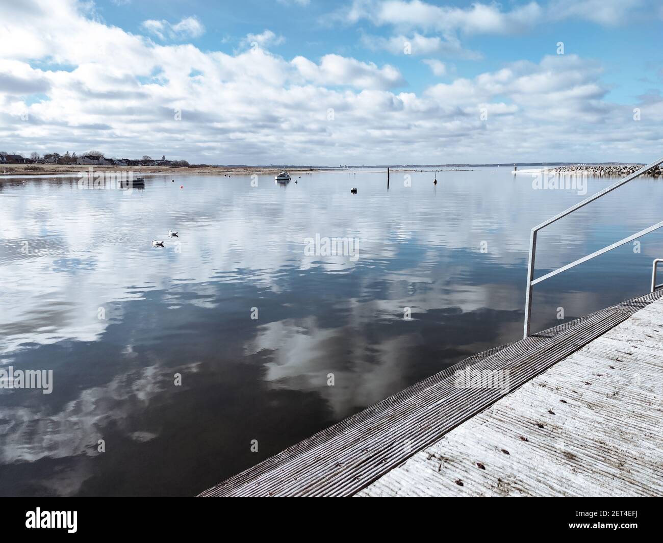 Photo of touristic wooden pier with observation deck entering the sea ...