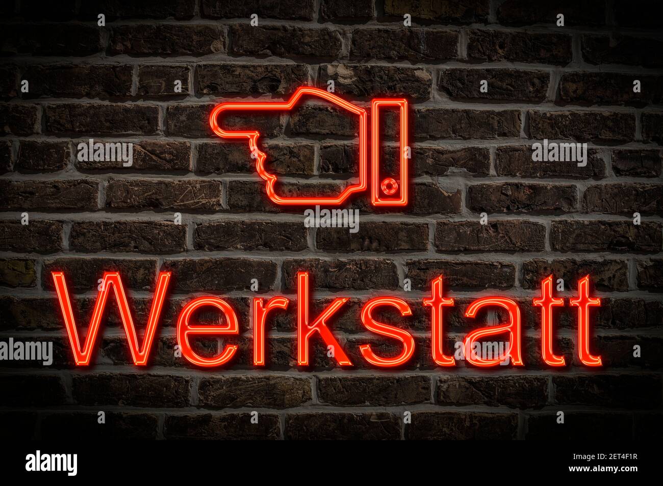 Detail photo of a neon sign on a wall with the inscription Werkstatt ...