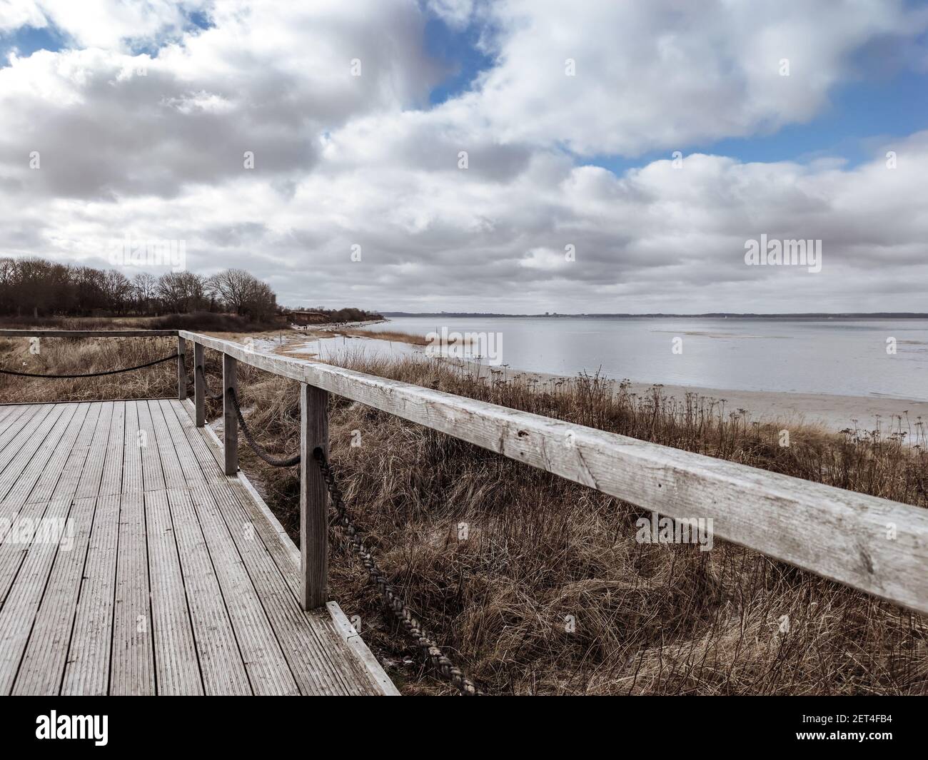 Photo of touristic wooden pier with observation deck entering the sea ...