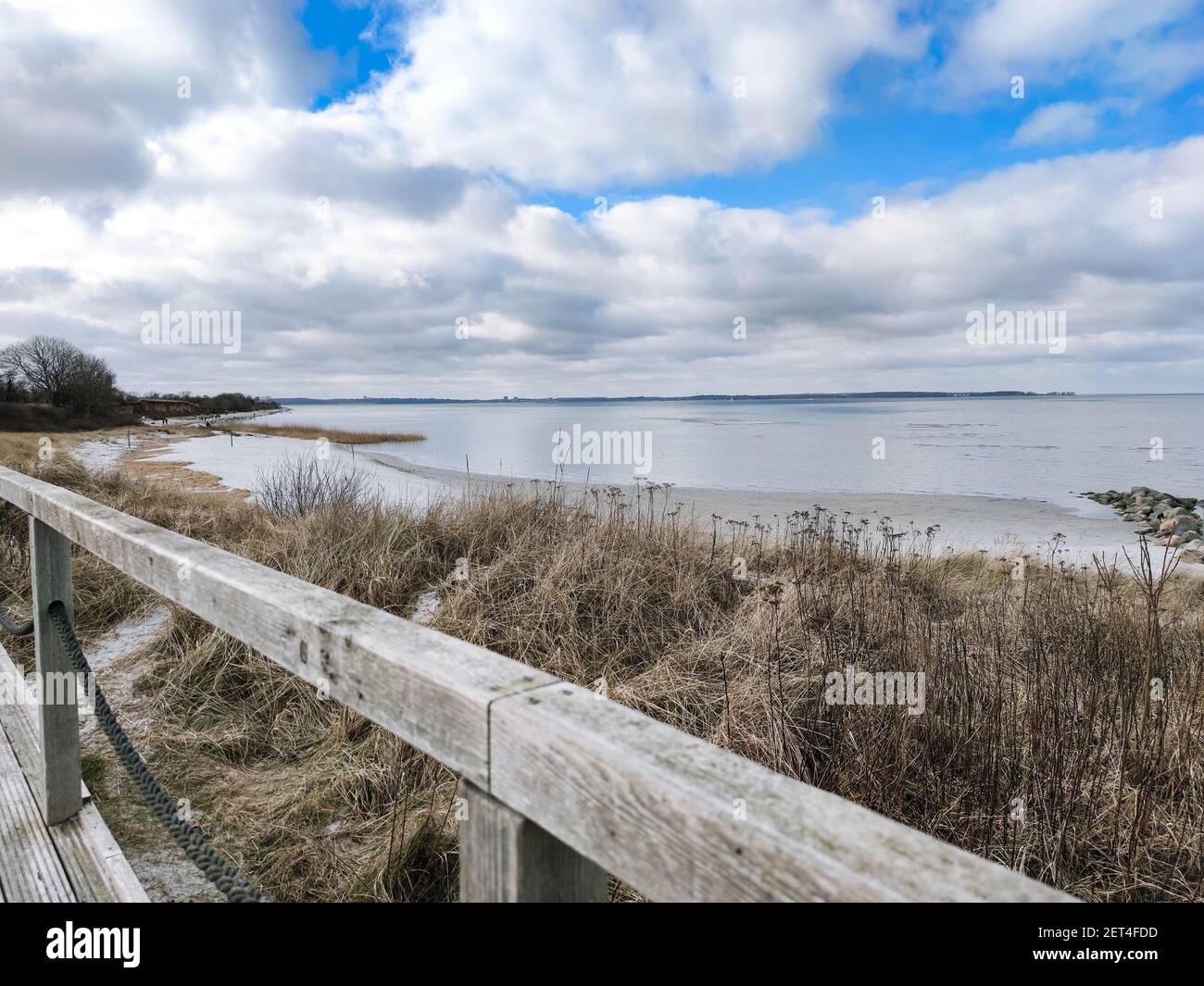 Photo of touristic wooden pier with observation deck entering the sea ...