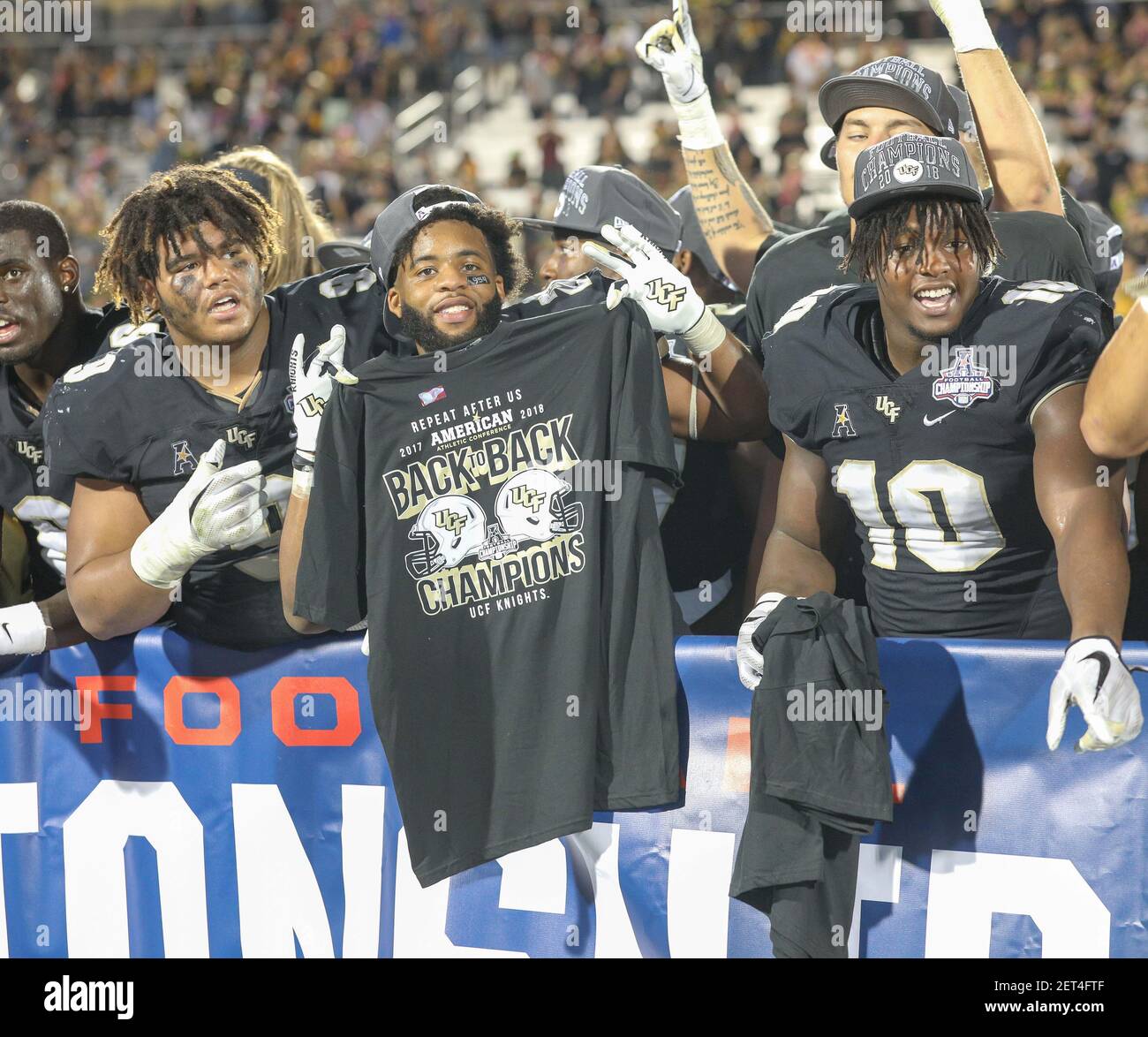 December 1, 2018: UCF platers hold up their back-to-back championship t ...