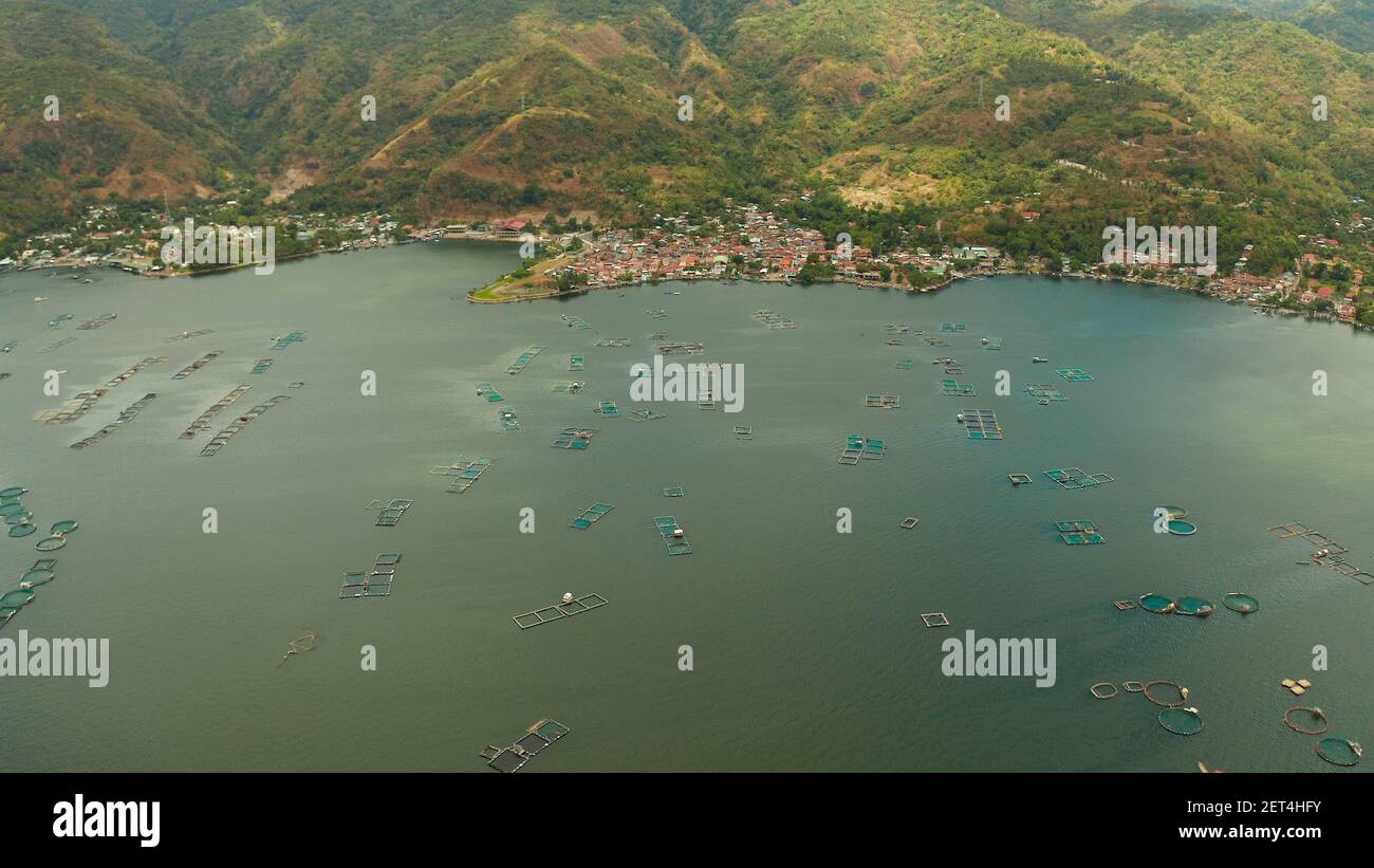 Aerial view of fish farm with cages for fish and shrimp on the lake ...