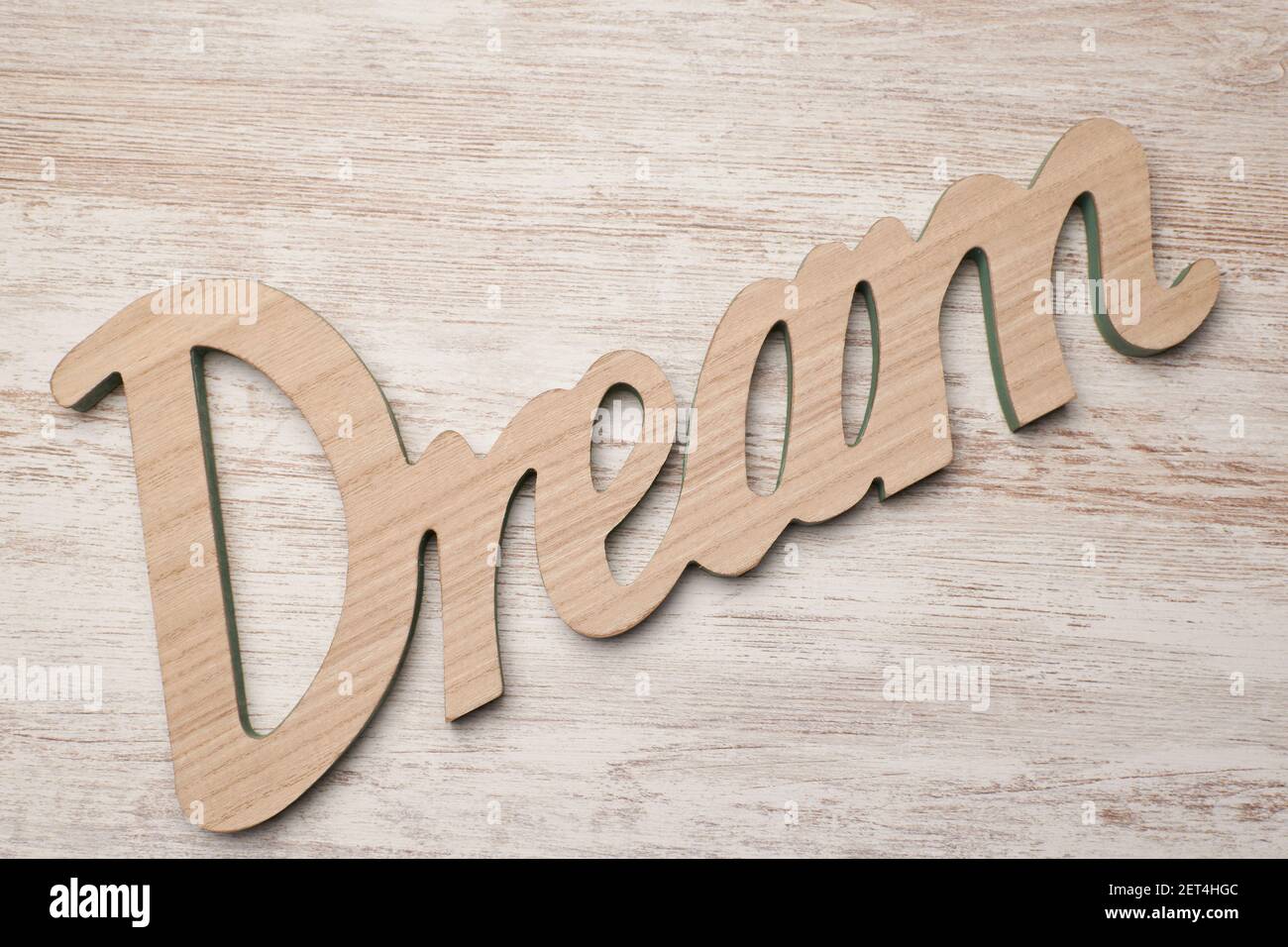 A top view of the word Dream on a wooden surface Stock Photo - Alamy
