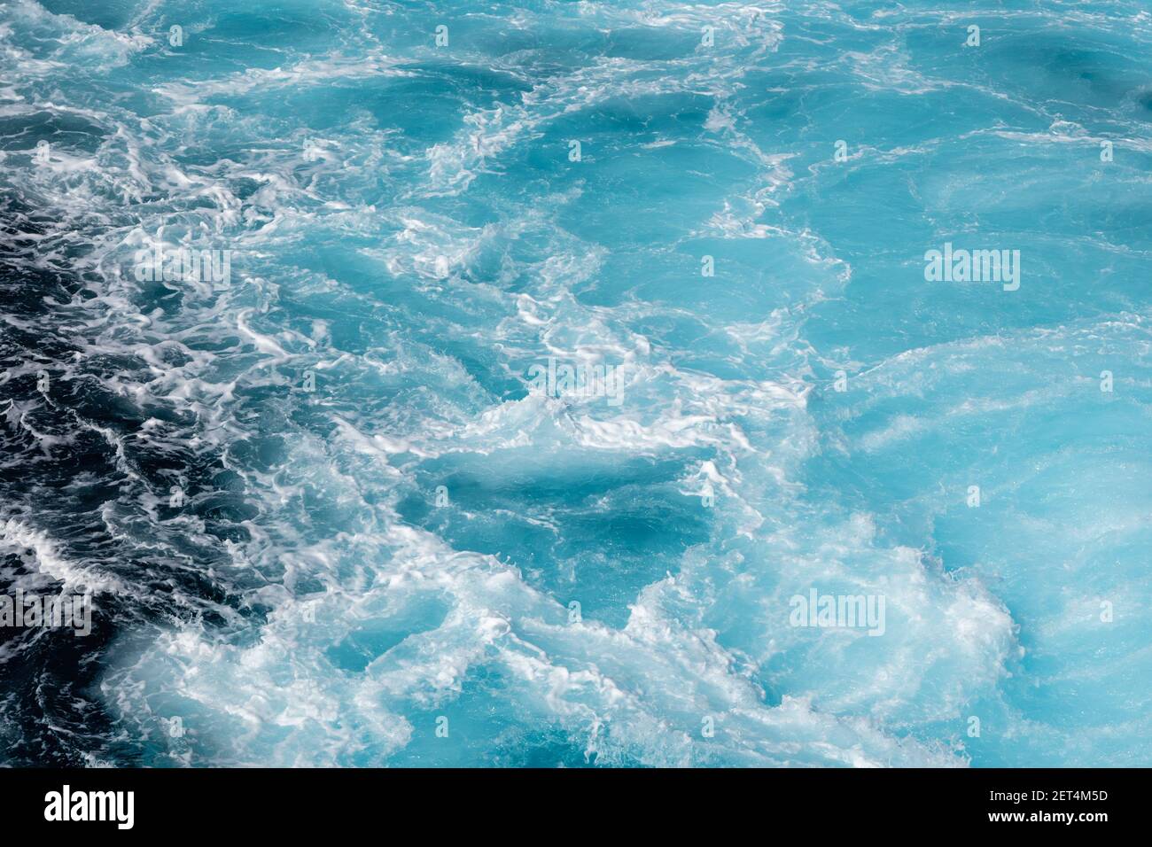 Natural background of blue foaming sea water Stock Photo - Alamy