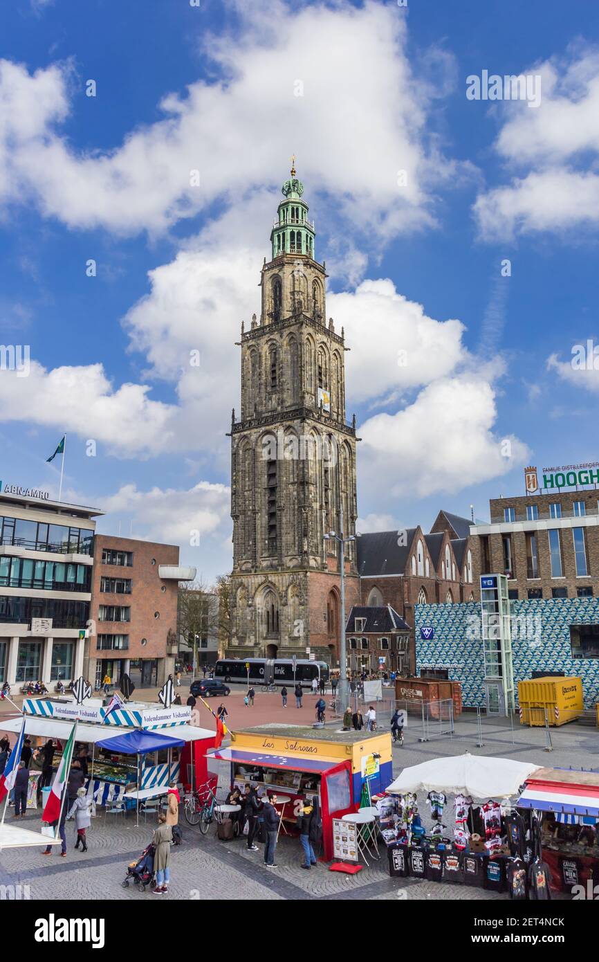 Church tower and market stalls on the central market square in ...