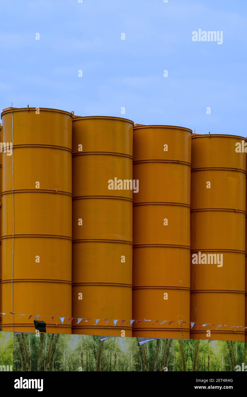 Yellow Construction Silos against blue sky. Vertical shot Stock Photo ...