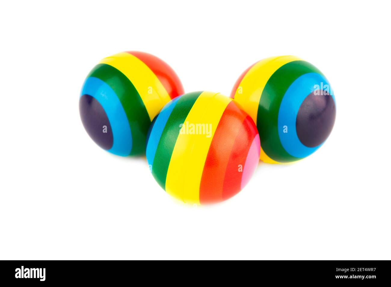 Three colorful striped rubber balls isolated on white background Stock ...