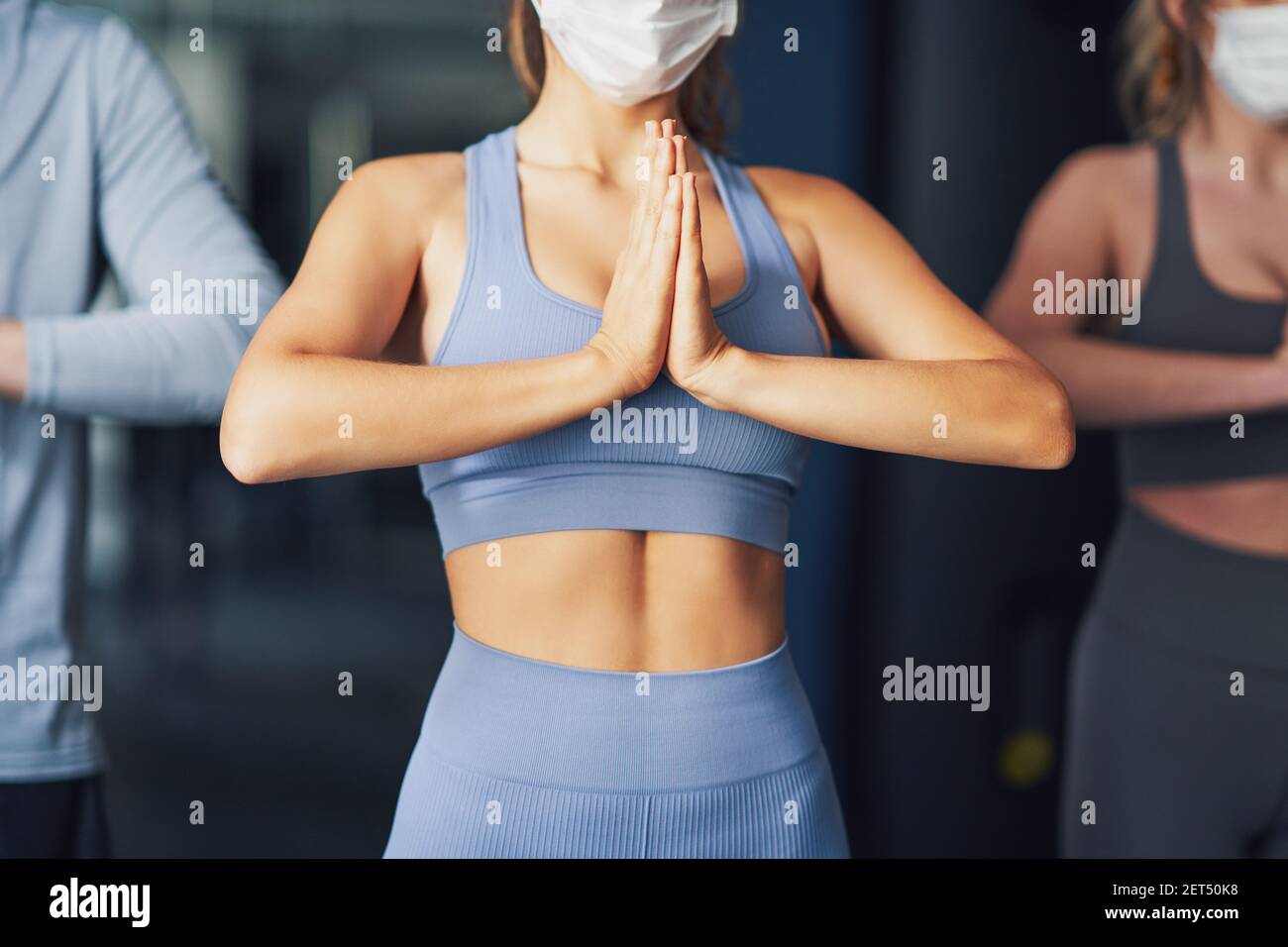Group of people wearing masks working out in a gym Stock Photo - Alamy