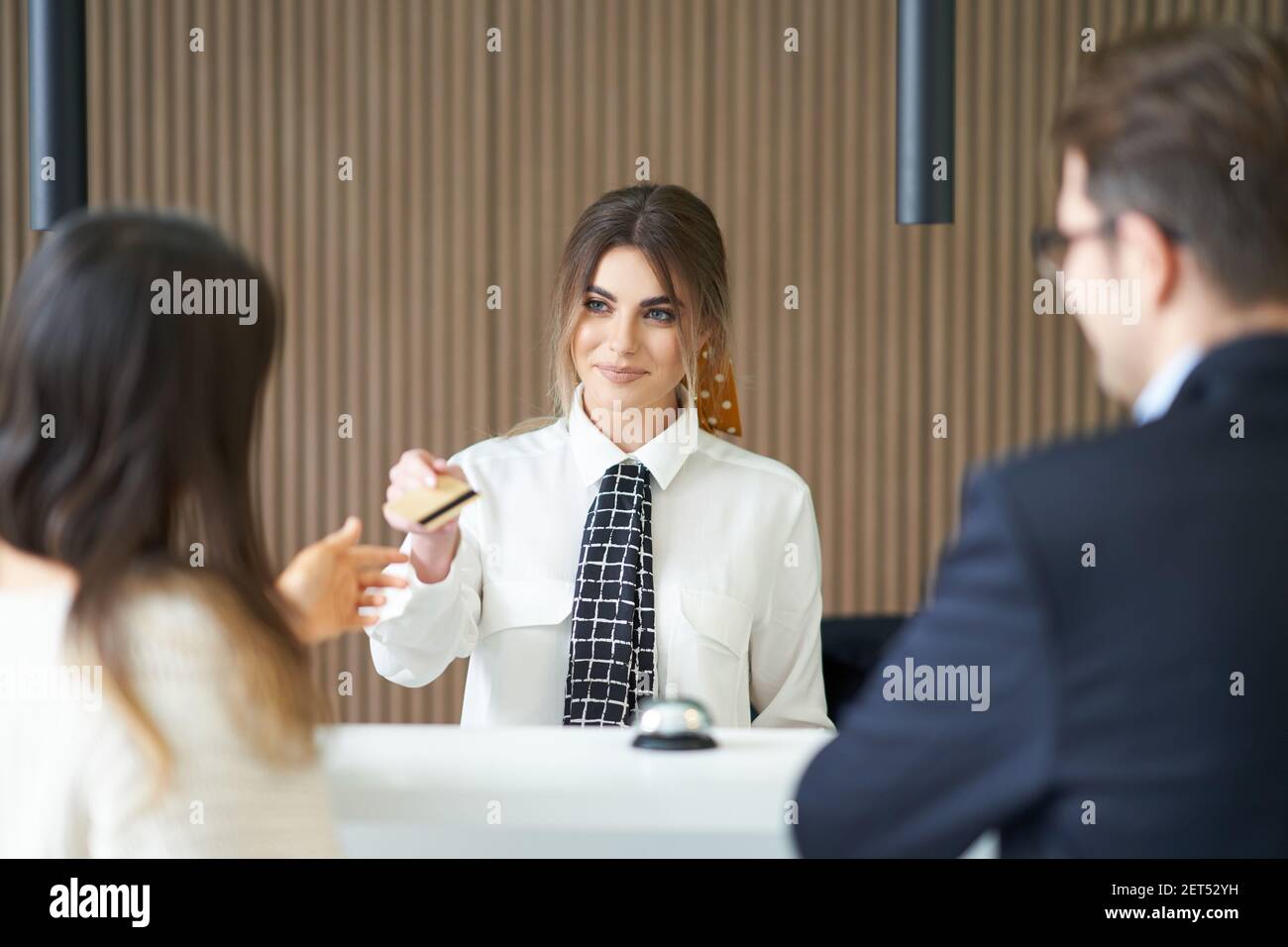 Receptionist working in a hotel Stock Photo - Alamy