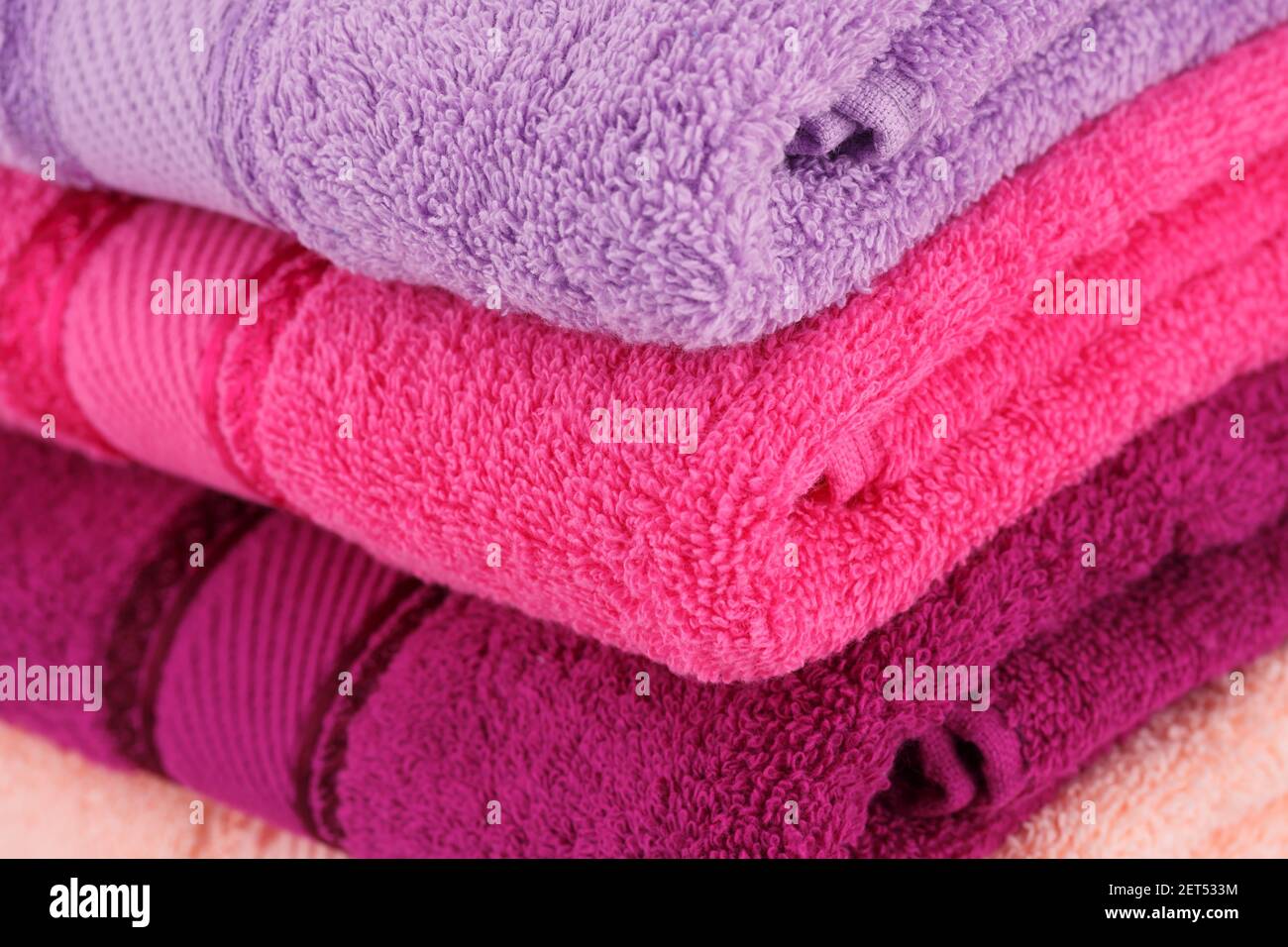 Colorful folded towels stack closeup picture Stock Photo - Alamy