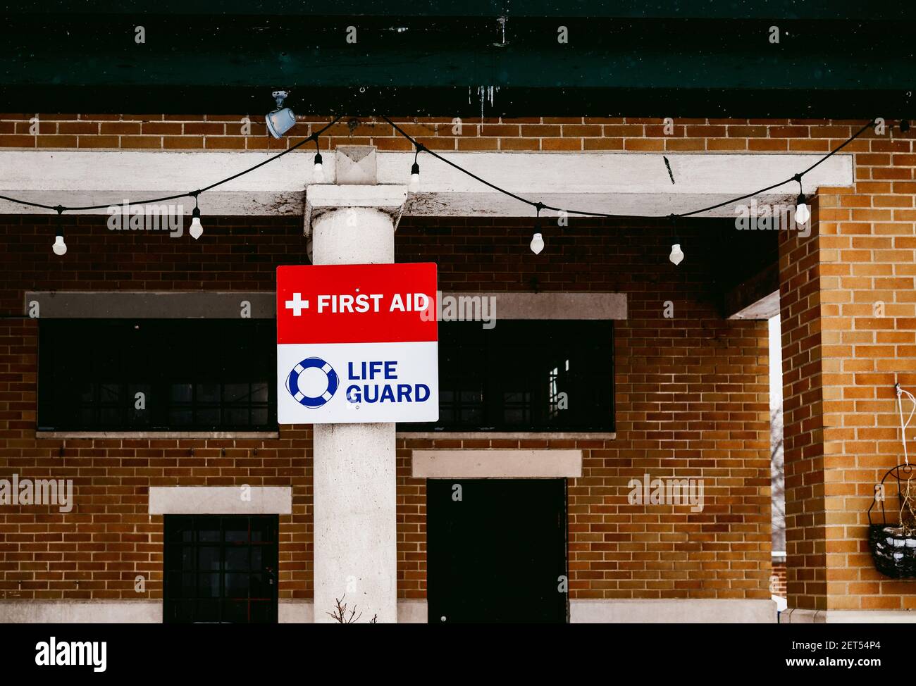 A signboard with the text "first aid", "life guard" attached to the ...