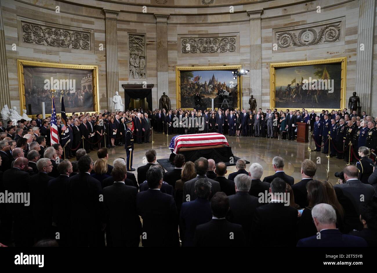 The flag-draped casket of former President George H.W. Bush lies in ...