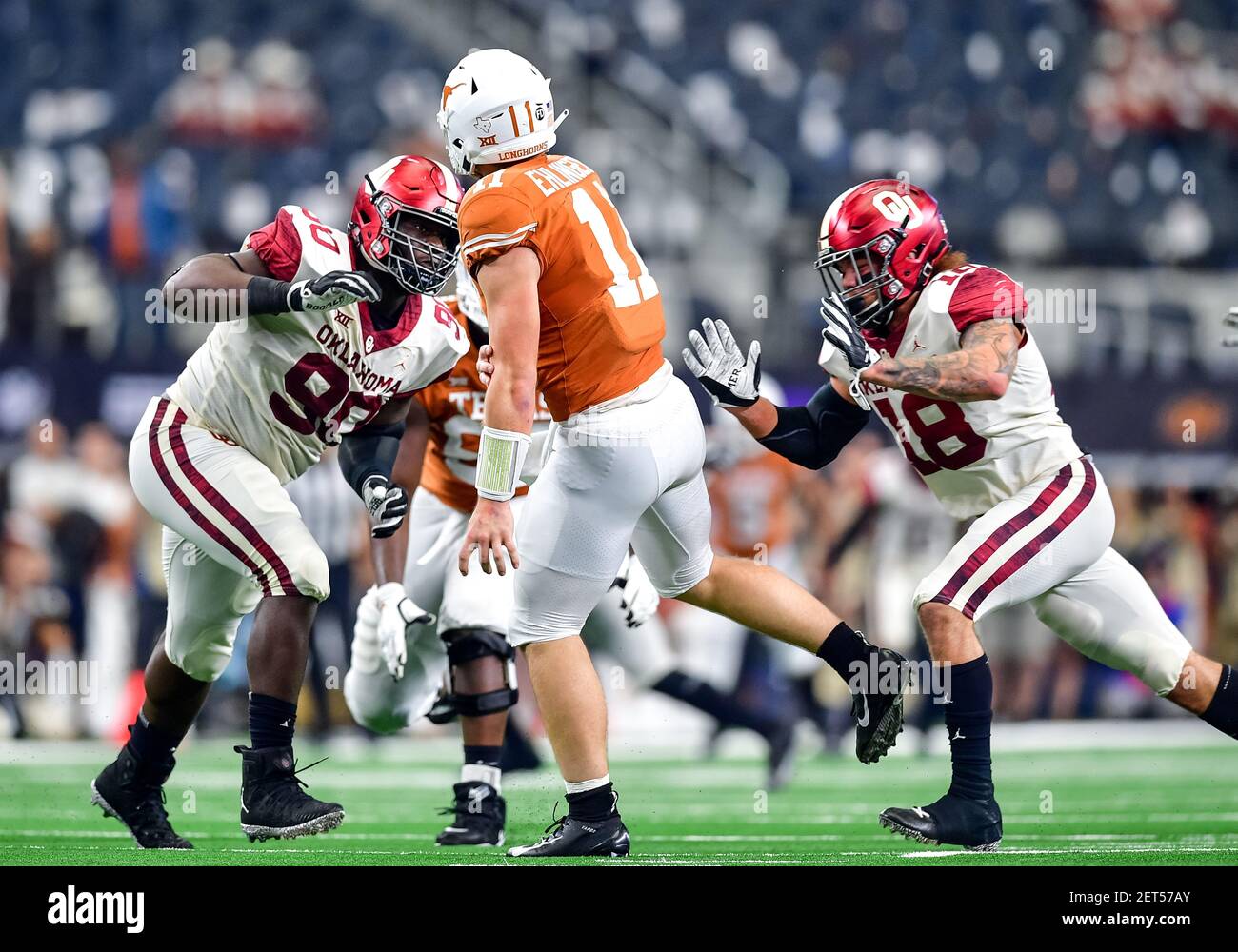 Texas Longhorns quarterback Sam Ehlinger (11) passes the ball as he is ...