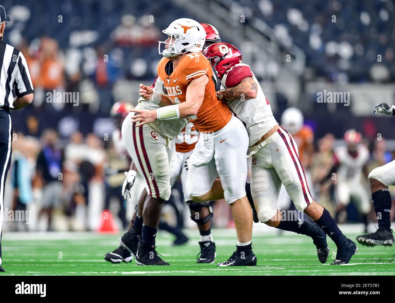 Texas Longhorns quarterback Sam Ehlinger (11) passes the ball as he is ...