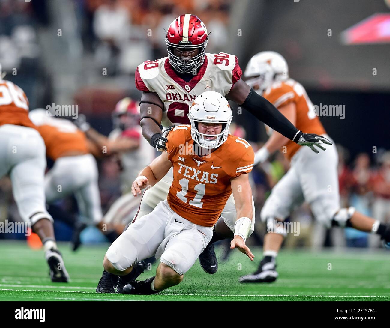 Texas Longhorns quarterback Sam Ehlinger (11) passes the ball as he is ...