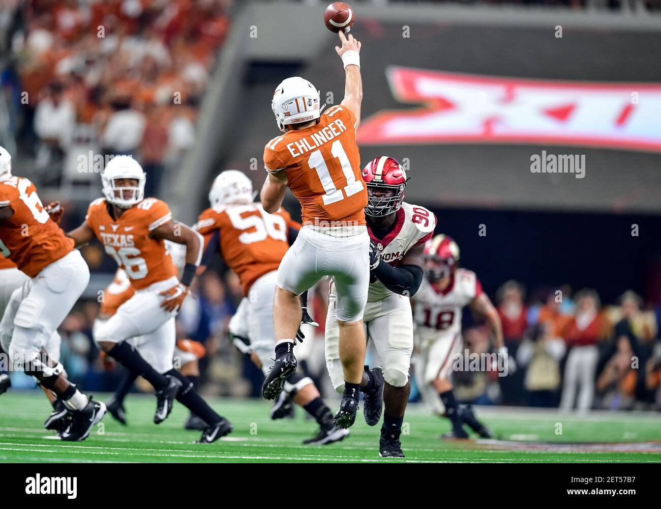 Texas Longhorns quarterback Sam Ehlinger (11) passes the ball as he is ...