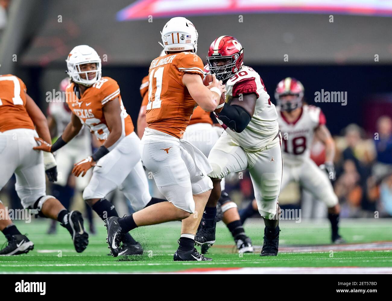 Texas Longhorns quarterback Sam Ehlinger (11) passes the ball as he is ...