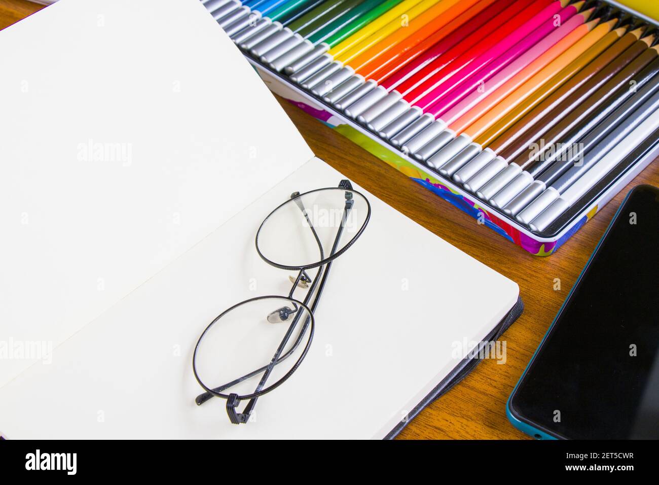 An artist's workplace desk with professional drawing supplies, circular ...
