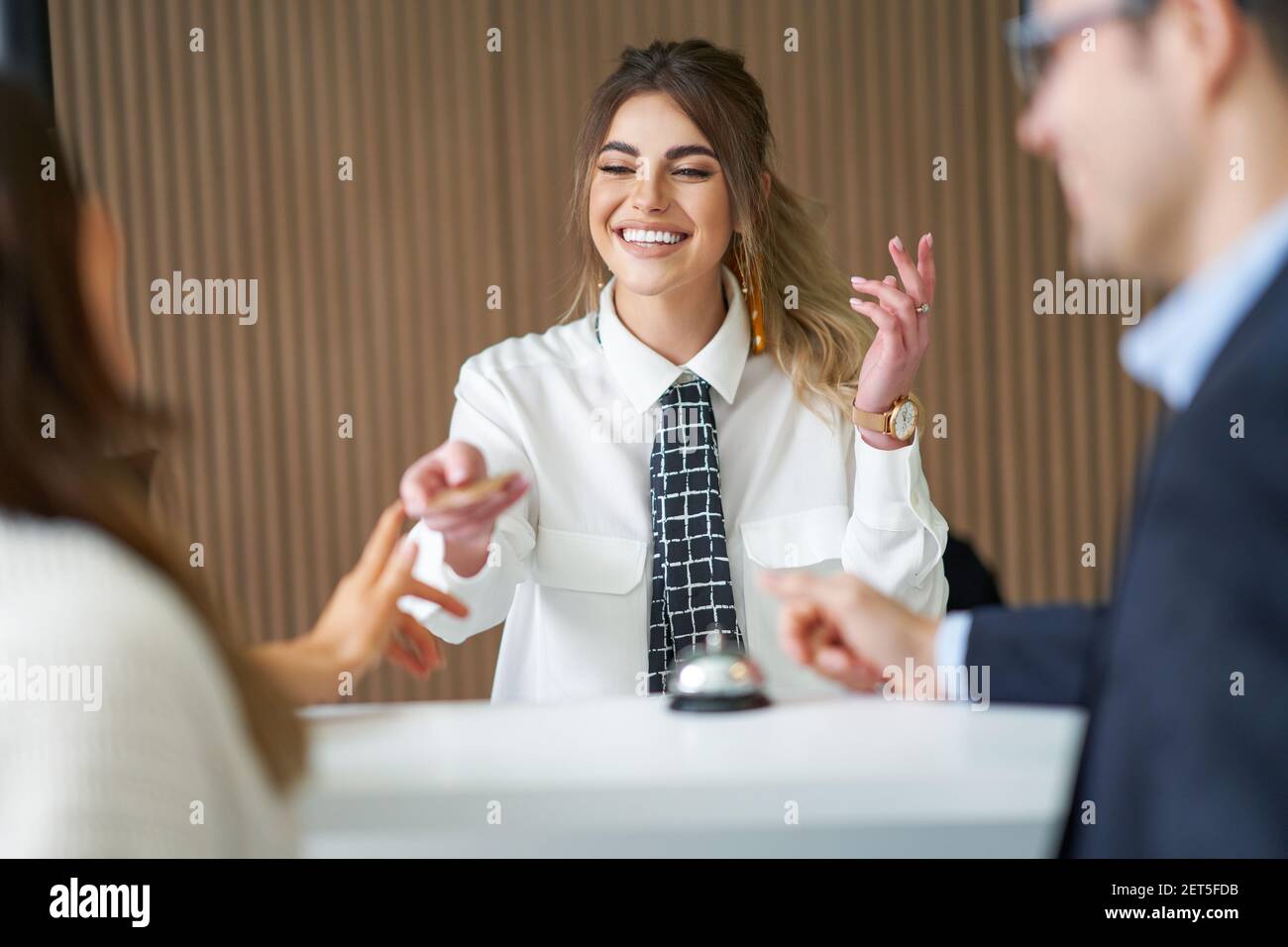Receptionist working in a hotel Stock Photo - Alamy