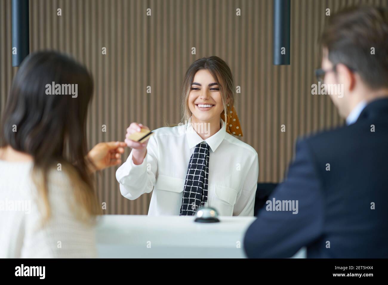 Receptionist working in a hotel Stock Photo - Alamy