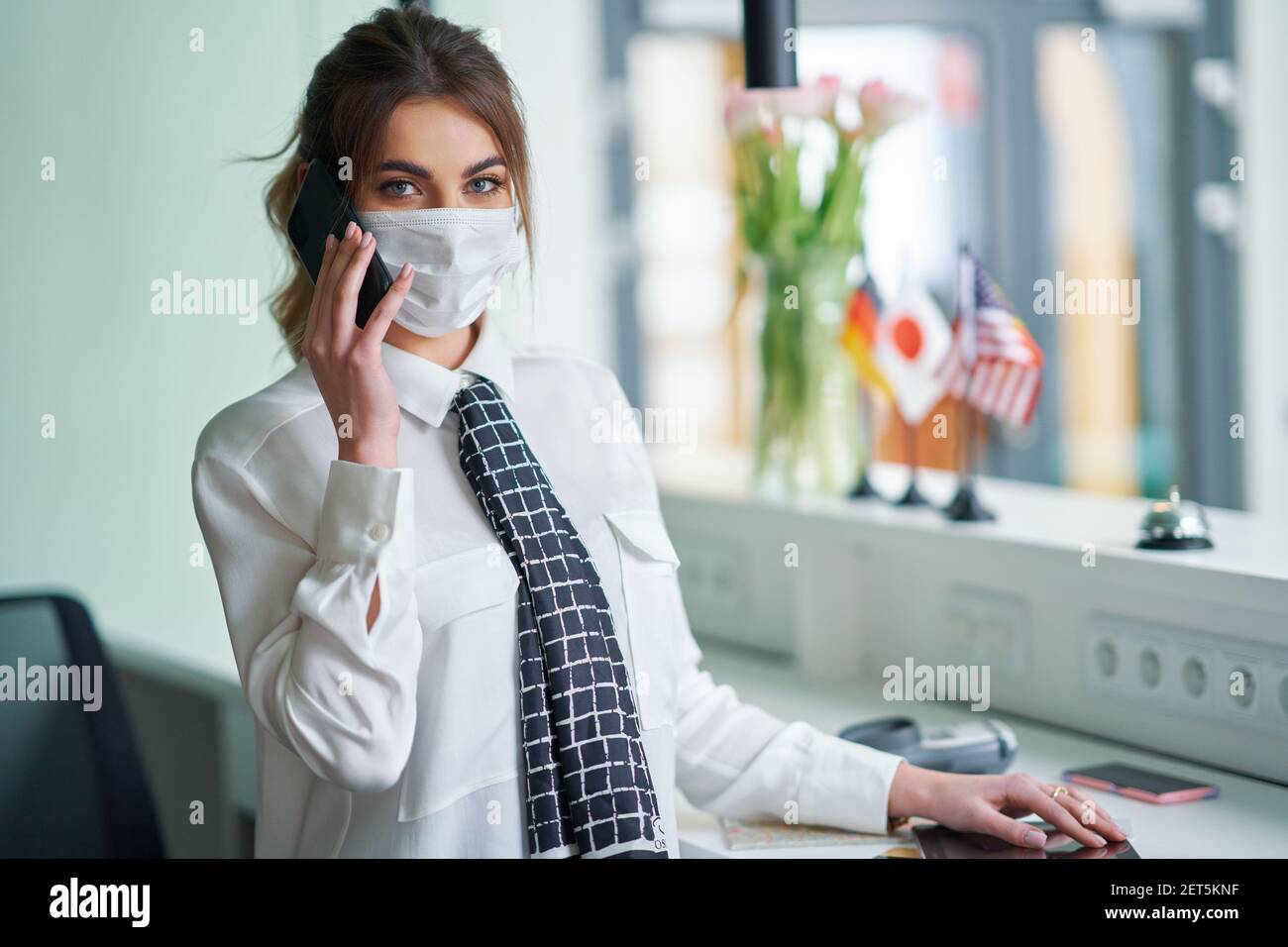 Hotel receptionist mask hi-res stock photography and images - Alamy