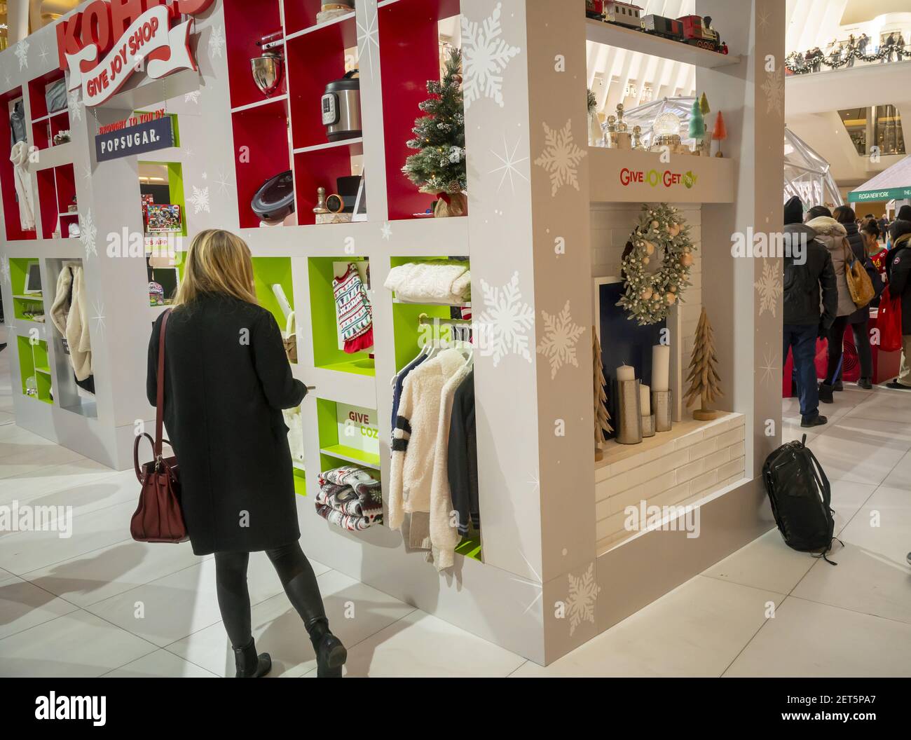 Visitors crowd the Kohl's "Give Joy Shop" pop-up branding event in the ...