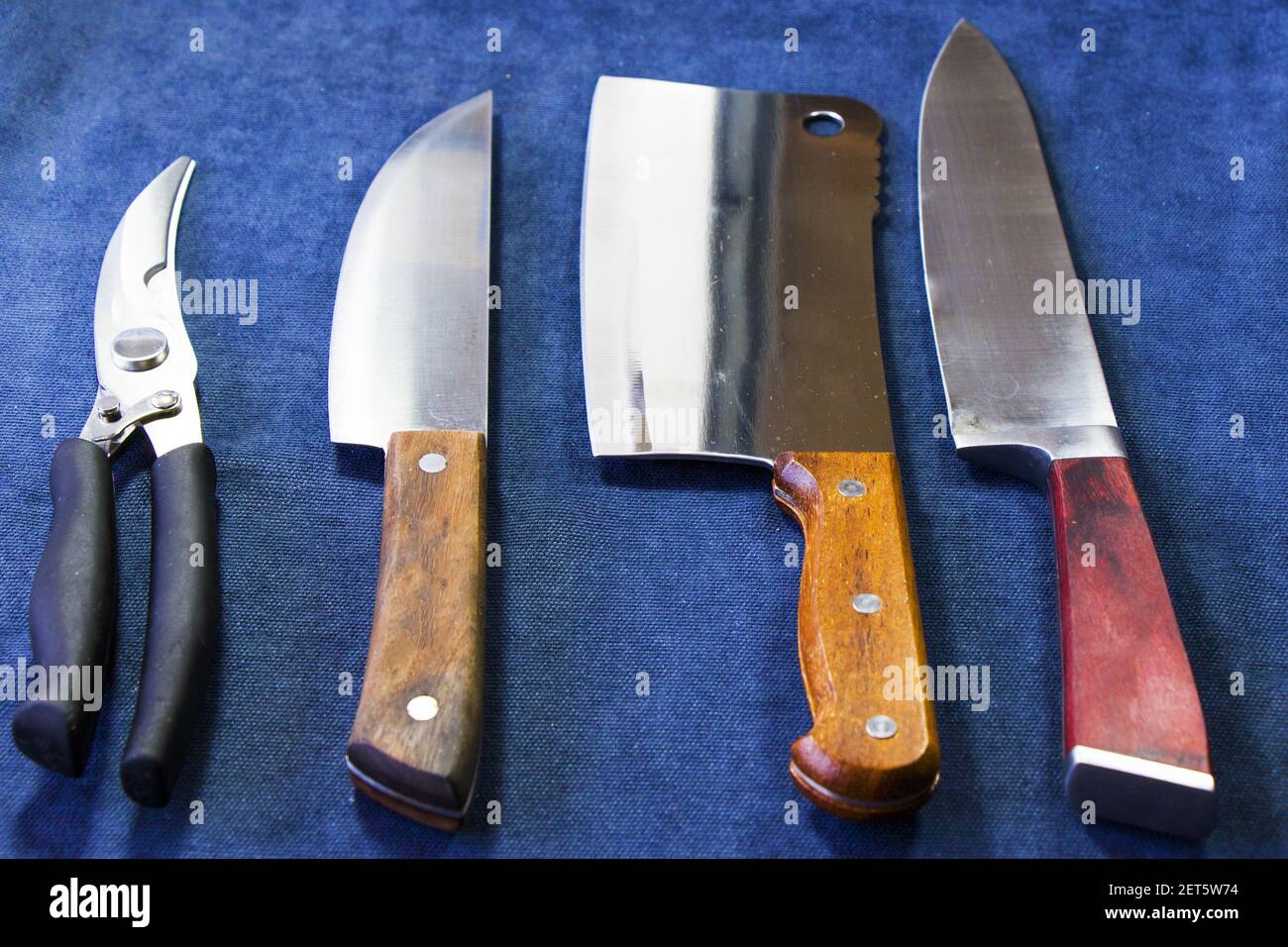 The kitchen knife collections on the blue background, tools, and ...