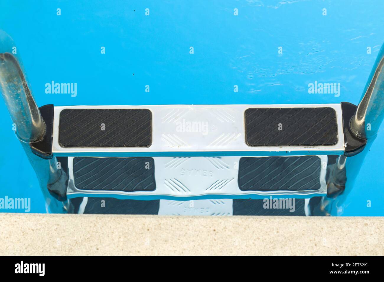 A swimming pool steps and water, summertime and empty pool, vacation ...