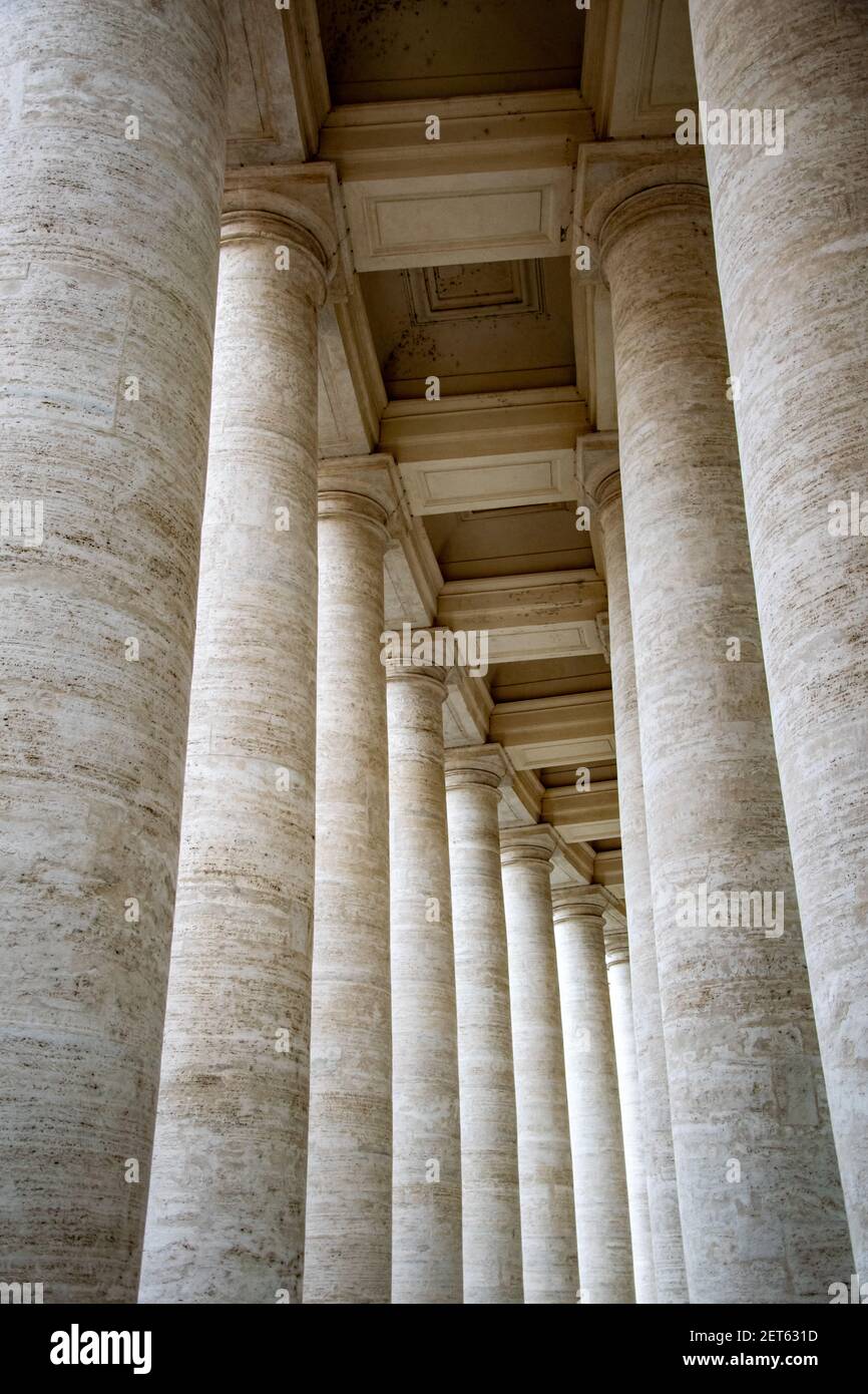 the beautiful stone pillars surrounding the Vatican building in Rome ...